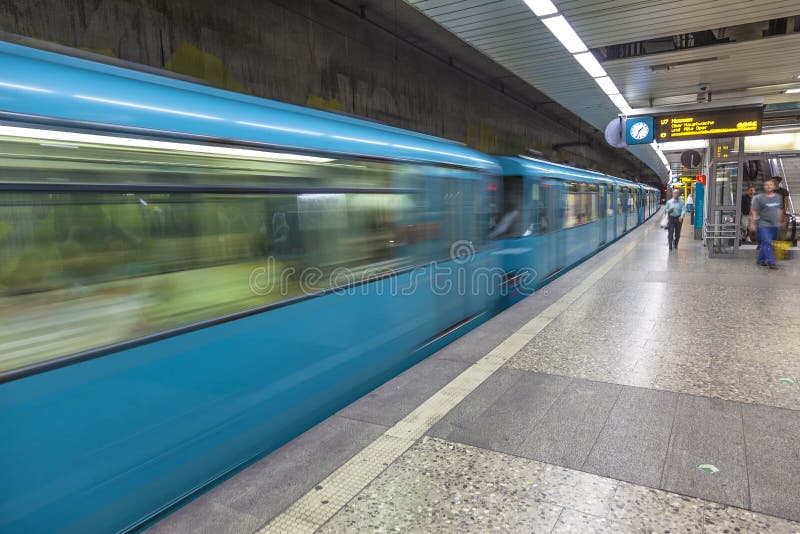 Blue Train Arriving in Station Editorial Stock Image - Image of motion ...