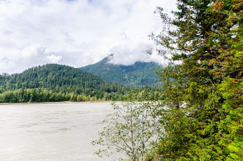 Fraser River with Cloud Covered Green Mountains in the Background in ...