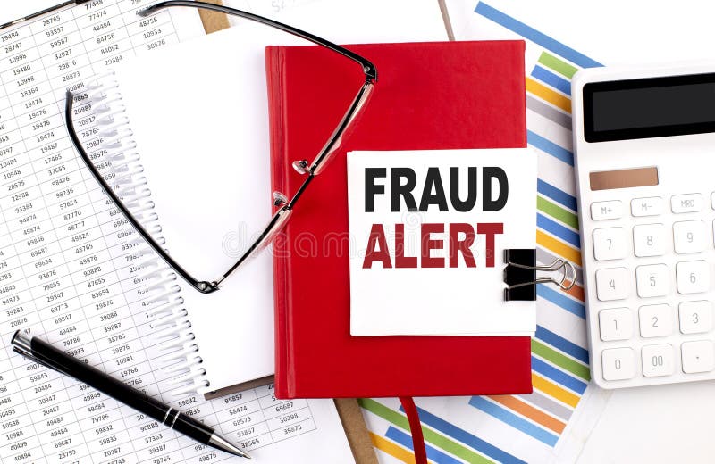 FRAUD ALERT Text on Notebook with Chart, Calculator and Pen Stock Image ...