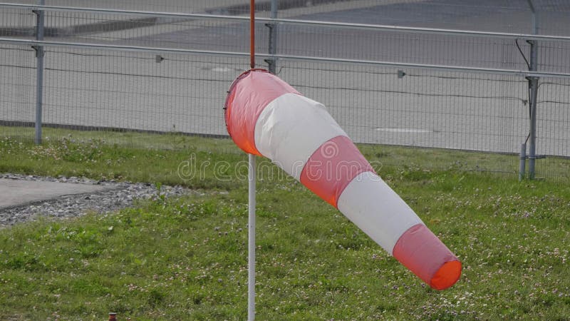 Frayed Windsock in Moderate Wind on the Airfield Stock Image - Image of ...