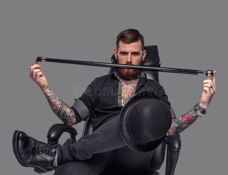 A Man Sitting on a Chair and Holds Walking Stick. Stock Image - Image ...