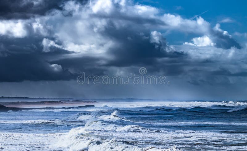 Freak Waves Breaking on Rocky Shore Under Dramatic Sky Stock Image ...