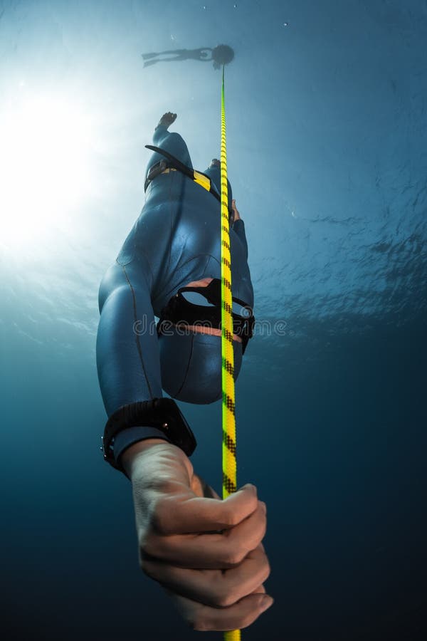 Free Diver Descending Along the Rope Stock Photo - Image of descending ...