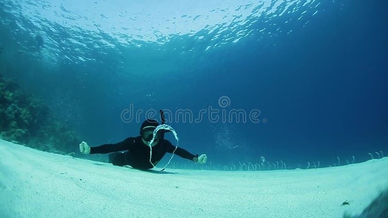 Free Diver Woman Relaxing after Diving with Fins in Blue Ocean with ...