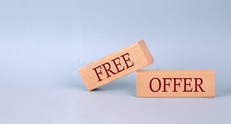 FREE OFFER Text on the Wooden Block, Blue Background Stock Image ...
