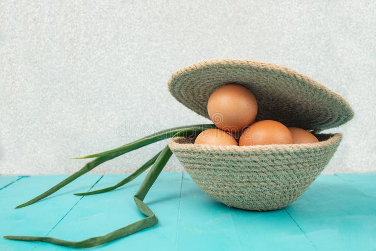 Free Range Chicken Eggs in a Jute Rope Basket on a Blue Boards Table ...
