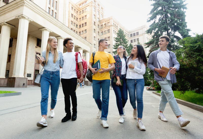 Free Time of Students. Friendly Students Walking after Classes Stock ...