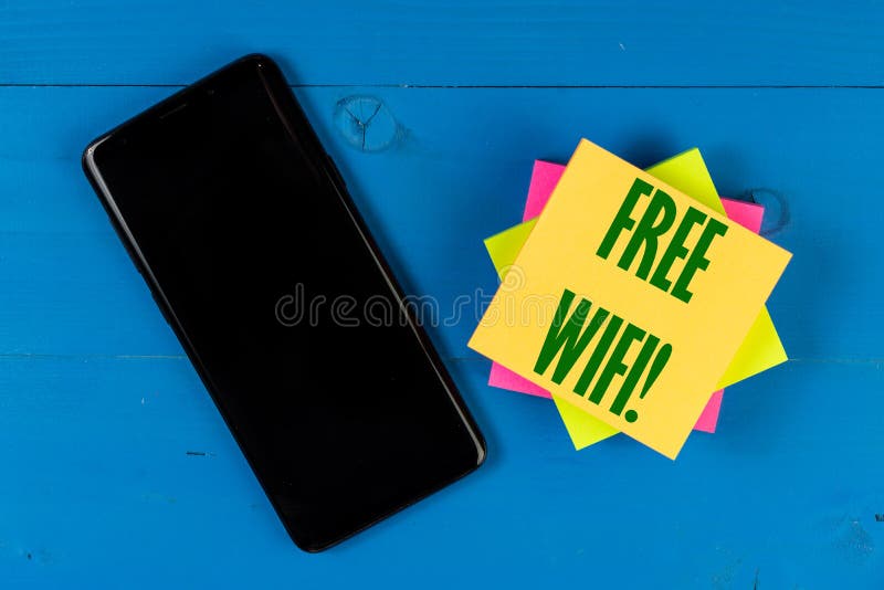 Free Wifi Text Concept on the Block Paper. Black Mobile Phone with ...