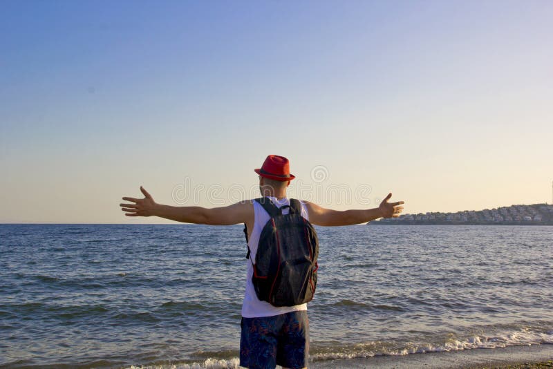 Free Young Man in a Red Hat on the Beach Stock Image - Image of sigacik ...