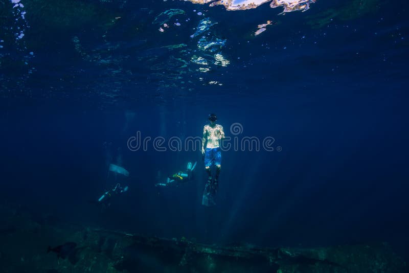 Freediver Man in the Depth Pop Up and Make Shaka Stock Photo - Image of ...