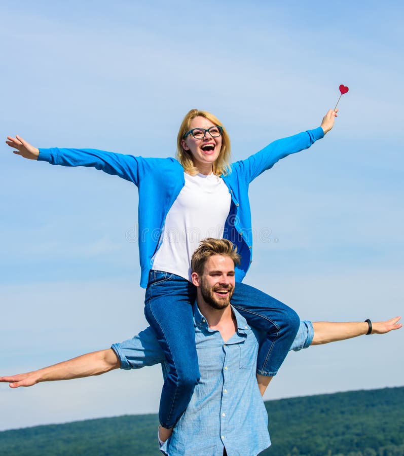 Man Carries His Girlfriend On Back Couple Having Fun On The Seashore