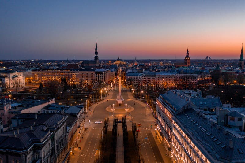 Freedom Monument Surrounded by Lights and Buildings during the Sunset ...