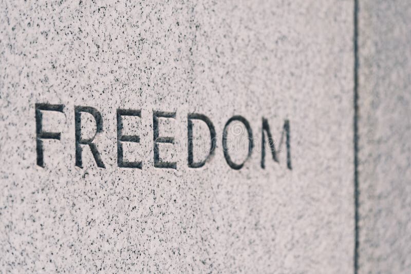 Freedom word set in stone stock image. Image of text - 317250423