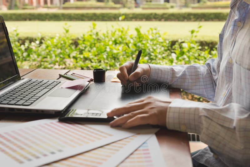 Freelance Graphic Designer Using Digital Tablet, Computer, Man W Stock ...