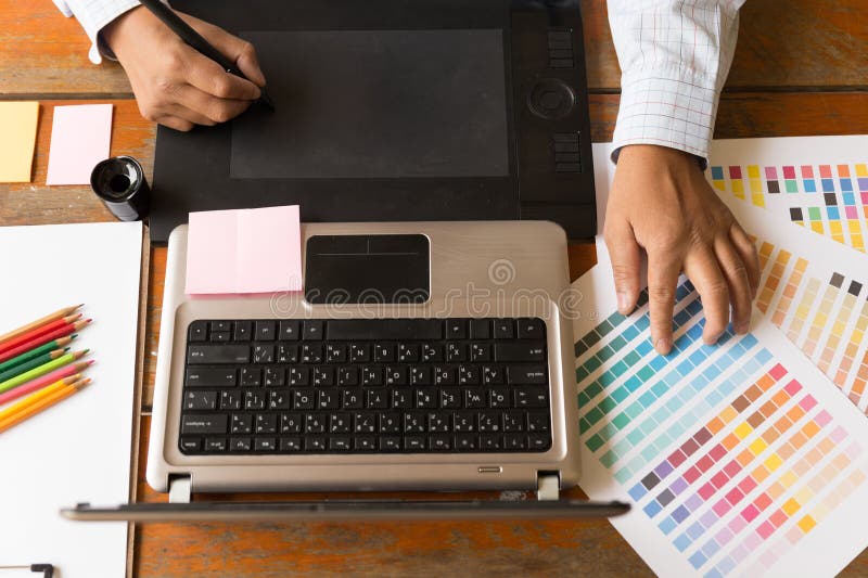 Freelance Graphic Designer Using Digital Tablet, Computer, Man W Stock ...