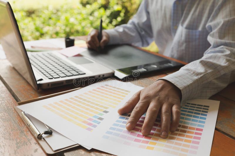 Freelance Graphic Designer Using Digital Tablet, Computer, Man W Stock ...