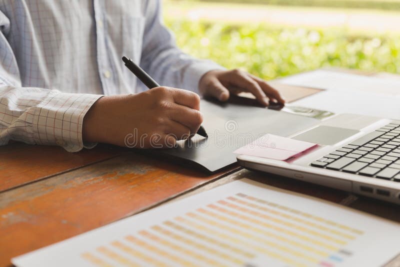 Freelance Graphic Designer Using Digital Tablet, Computer, Man W Stock ...