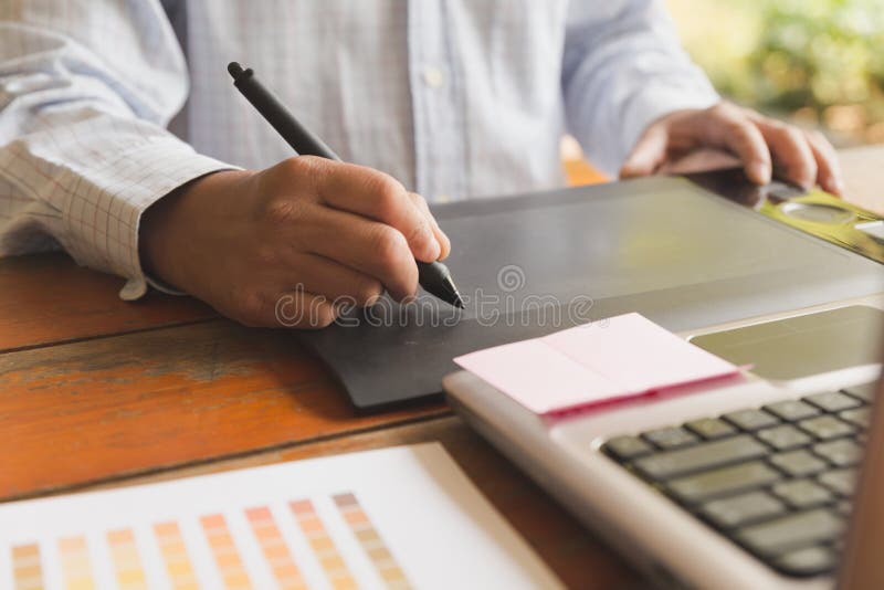 Freelance Graphic Designer Using Digital Tablet, Computer, Man W Stock ...