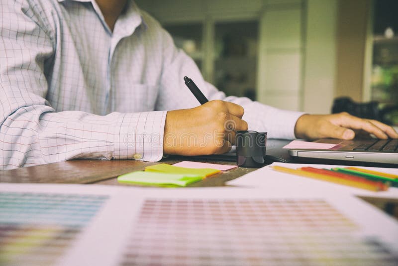 Freelance Graphic Designer Using Digital Tablet, Computer, Man W Stock ...