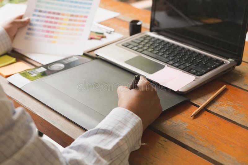 Freelance Graphic Designer Using Digital Tablet, Computer, Man W Stock ...