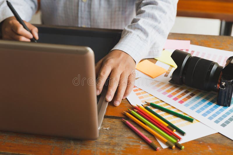 Freelance Graphic Designer Using Digital Tablet, Computer, Man W Stock ...