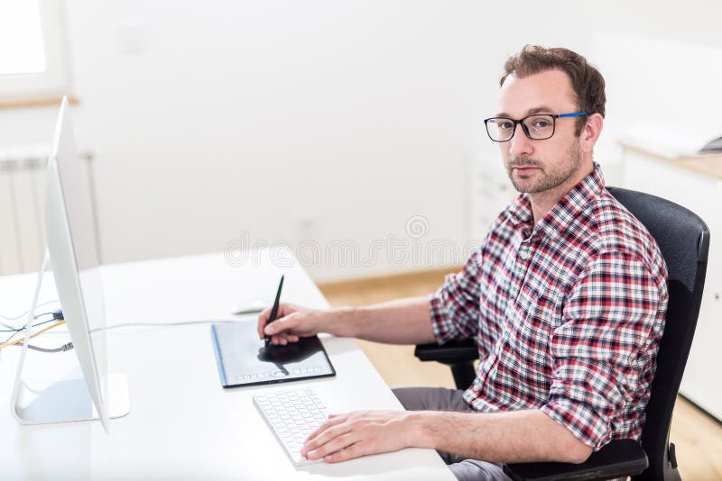 Freelance Graphic Designer Working on His Computer Stock Photo - Image ...