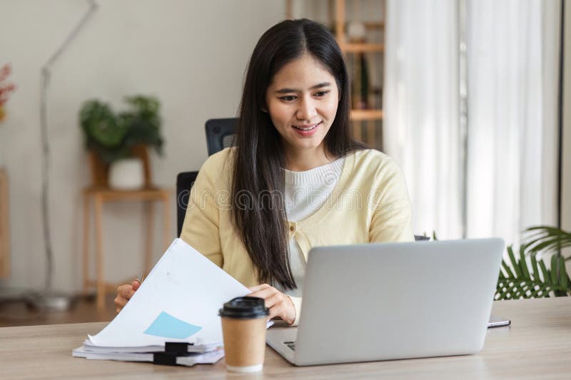 Freelance Professional Reviewing Documents and Managing Tasks from Home Office, Highlighting ...