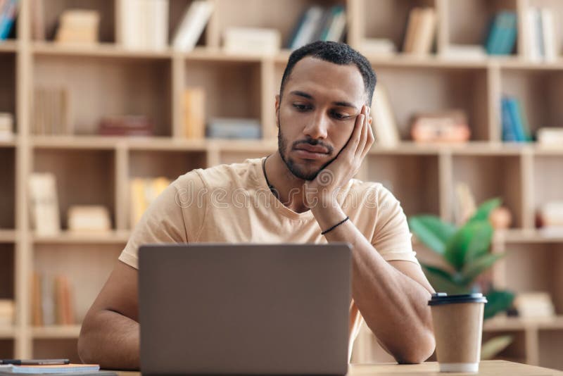 Freelance Stress Concept. Overworked Arab Man Sitting at Workplace and ...