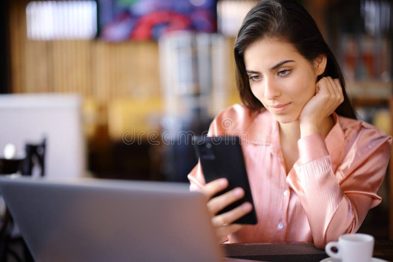 Freelance Worker Using Multiple Devices in a Bar Stock Image - Image of ...