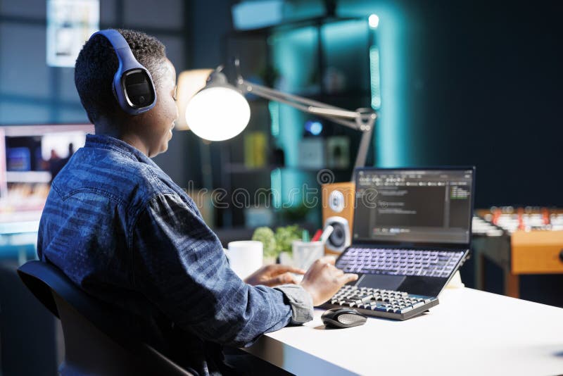 Freelancer Coding and Listening To Music Stock Photo - Image of ...