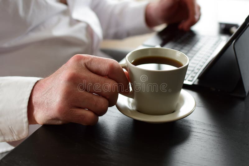 Freelancer is Drinking Coffee. Concept: Remote Work. Stock Photo ...