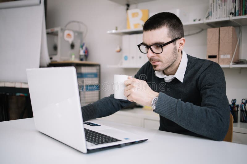 Freelancer Drinking Tea and Working in Office Stock Photo - Image of ...