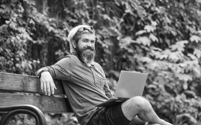 Freelancer Man Working on Computer. Businessman Using Notebook in Park ...