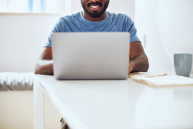 Freelancer Operating a Laptop while Doing a Work Task Stock Photo ...