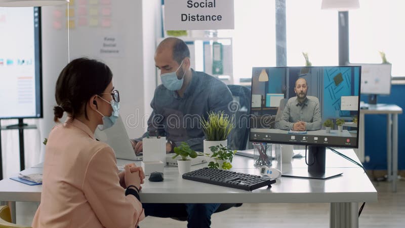 Freelancer with Protective Face Mask Talking with Collegue during ...