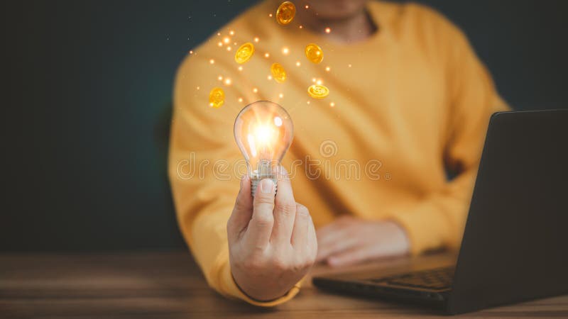 Freelancer Touching a Bright Light Bulb. Ideas for Making Money from ...