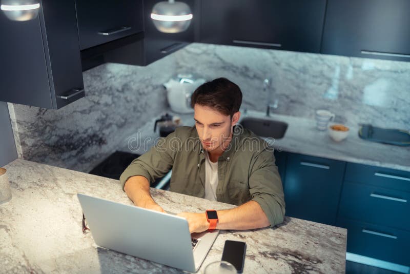 Freelancer Wearing Smart Watch Sitting at Home and Working Stock Image ...