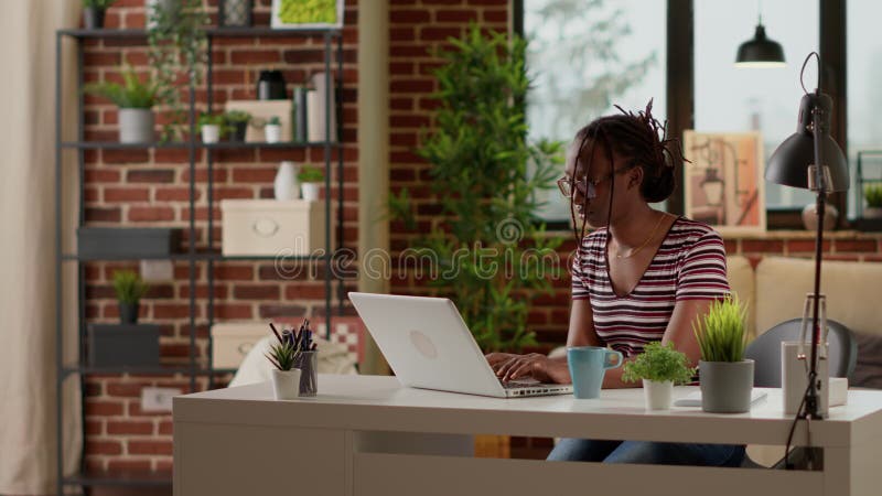 Freelancer Woman Sitting at Home Desk and Working Remotely Stock Video ...