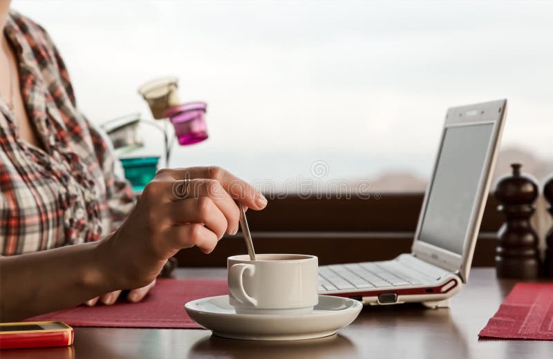 Freelancer Working on Computer at Cafe and Drinking Coffee Stock Image ...