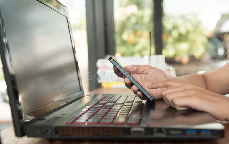 Freelancer Working on Computer at Coffee Shop. Stock Photo - Image of ...