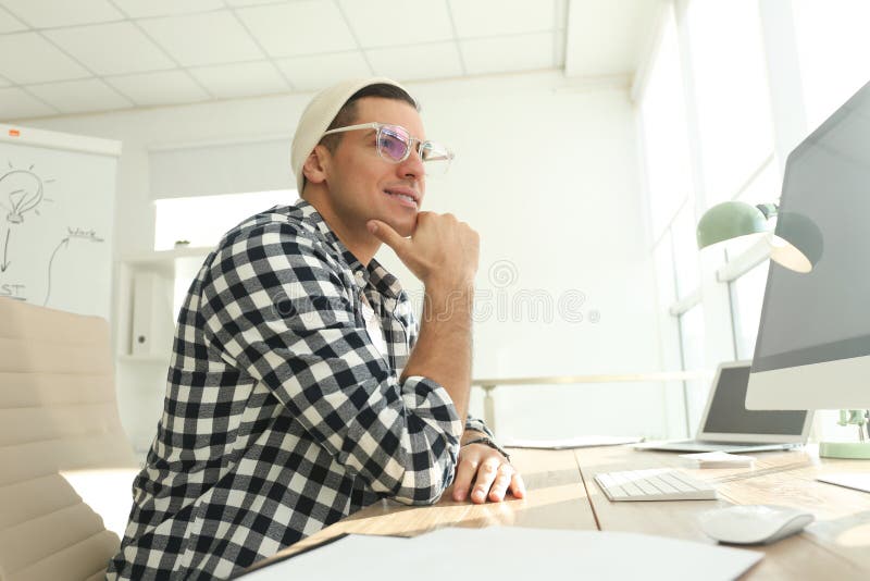 Freelancer Working on Computer at Table Indoors Stock Photo - Image of ...