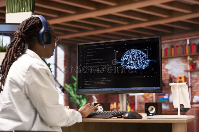 Freelancing Computer Engineer Doing Maintenance on AI, Listening Music ...