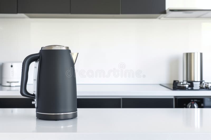 Freestanding Electric Kettle on a Minimalist White Kitchen Counter ...