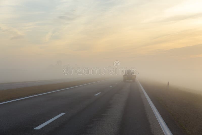 Freeway and a car in fog stock image. Image of outdoor - 90669353