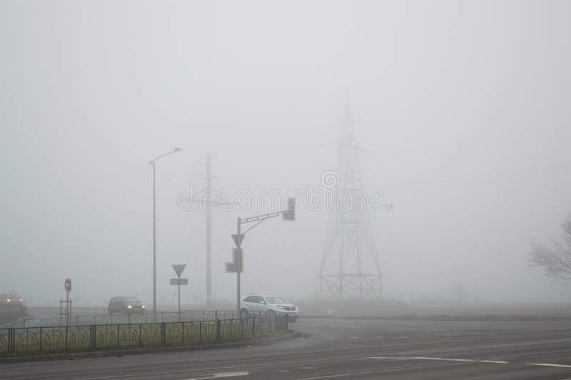 Freeway and Intersection with Traffic Lights in Dense Fog Stock Image ...