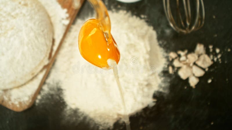 Freeze Motion of Falling Raw Egg into Flour Stock Photo - Image of ...