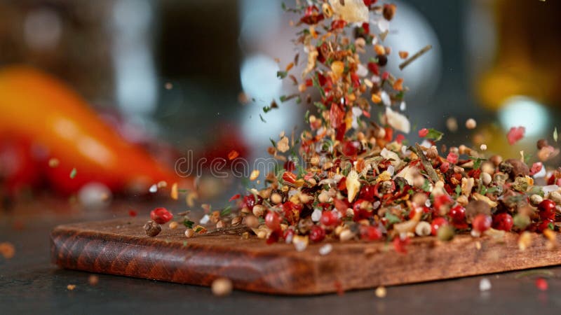 Freeze Motion of Falling Spice Mix on Cutting Board Stock Image - Image ...