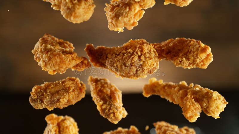 Freeze Motion of Flying Pieces of Fried Chicken Pieces Stock Photo ...