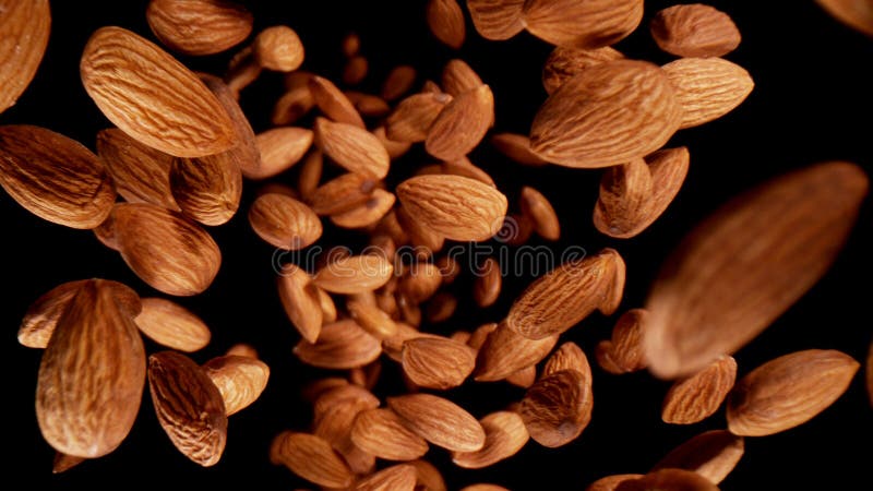 Freeze Motion of Flying Whole Almonds Stock Photo - Image of food ...