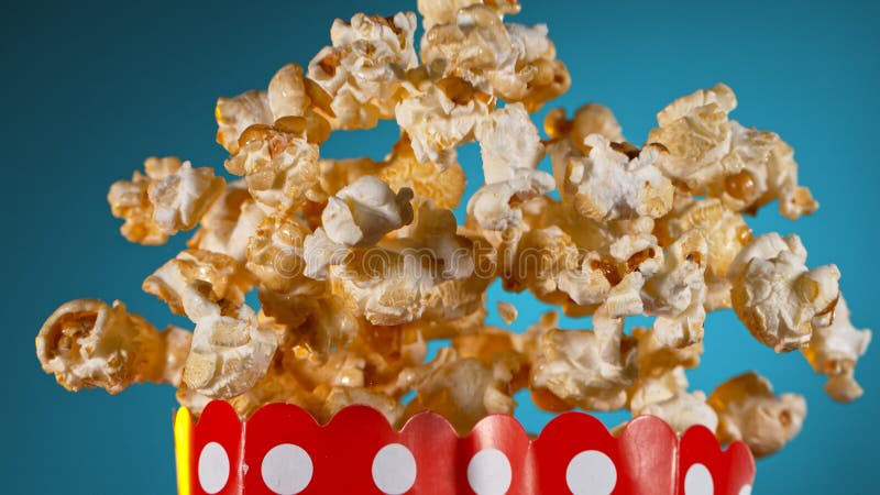 Freeze Motion of Popcorn Flying on Gradient Blue Background. Stock ...